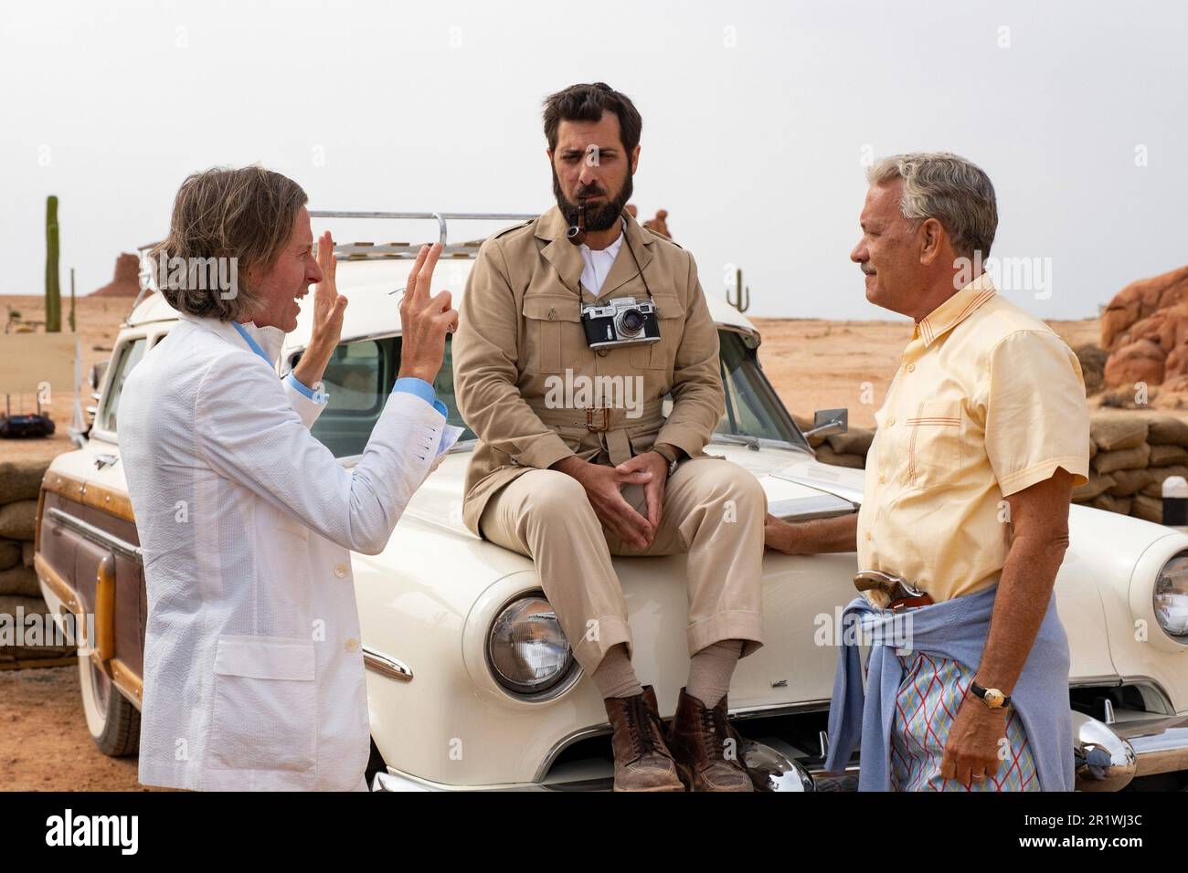 ASTEROID CITY, from left: director Wes Anderson, Jason Schwartzman, Tom Hanks, on set, 2023. ph ...