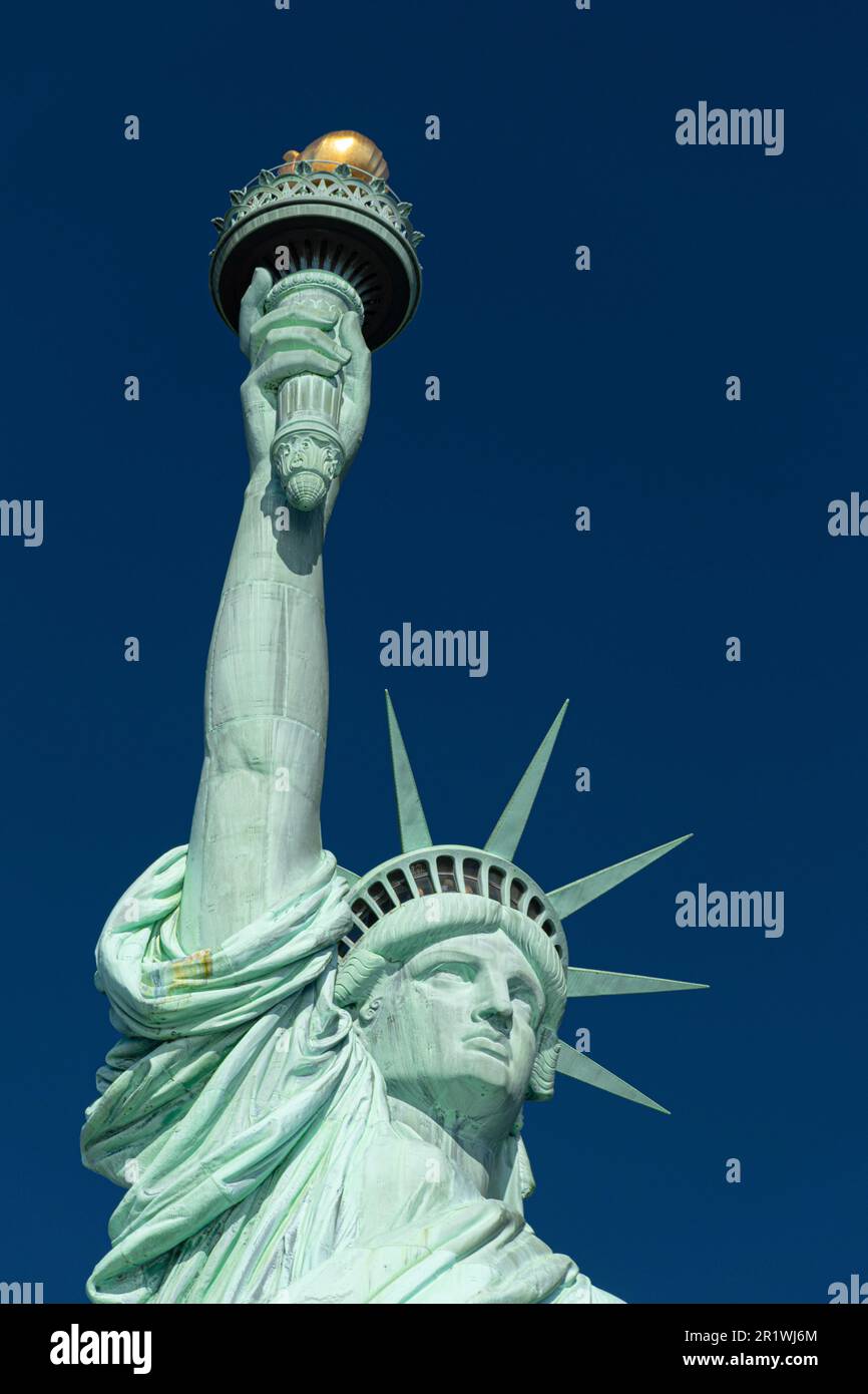 Close-up of the crown, the arm, and the torch of the Statue of Liberty ...