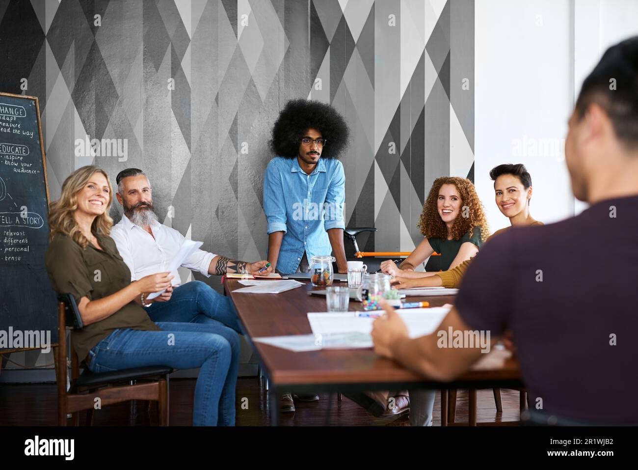 Bringing their ideas to the table. a group of designers having a ...