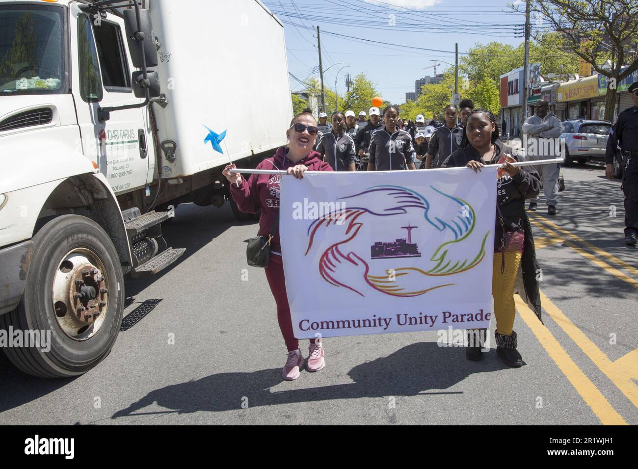 Children of various ages march along Mermaid Avenue in the Community ...