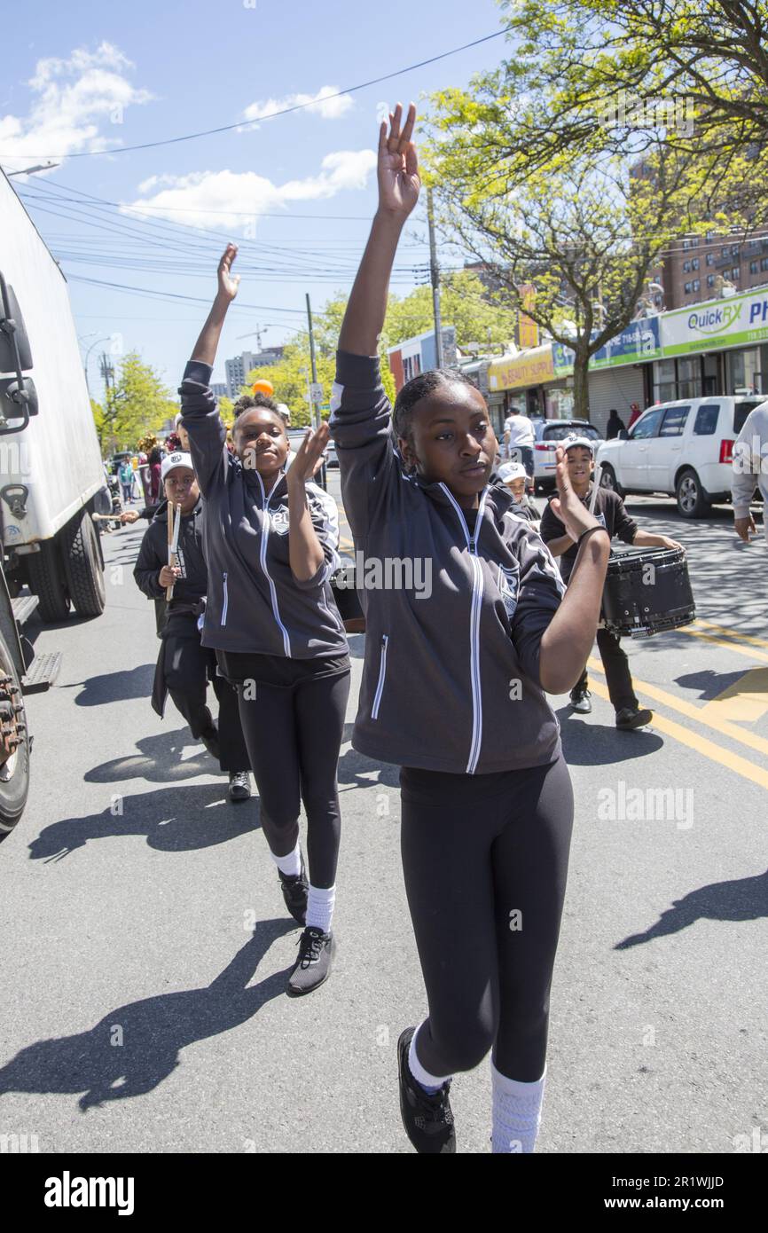 Children of various ages march along Mermaid Avenue in the Community ...