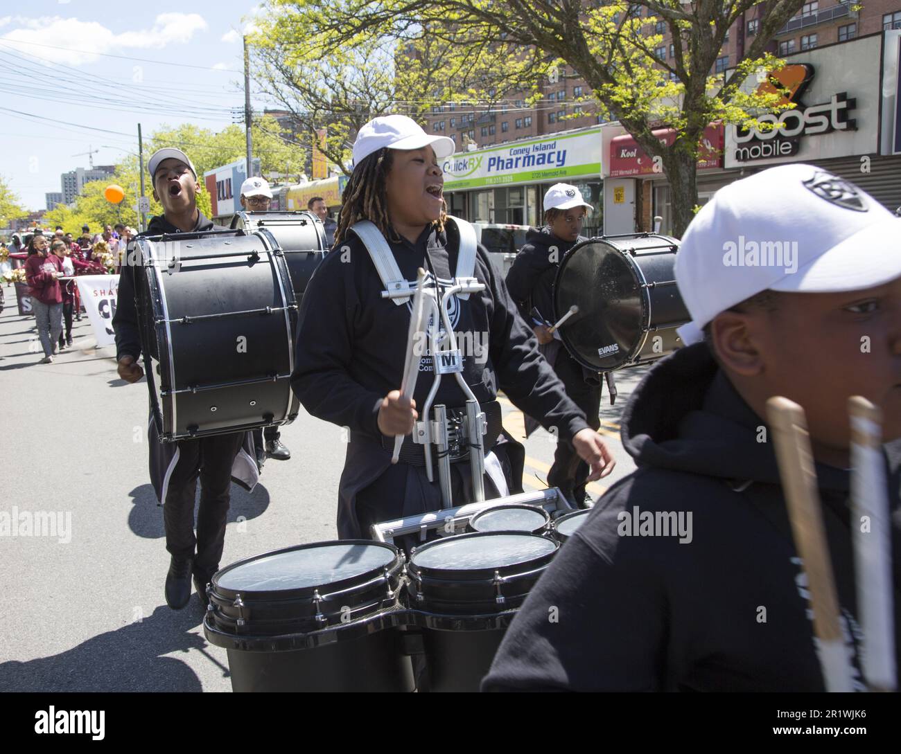 Children of various ages march along Mermaid Avenue in the Community ...