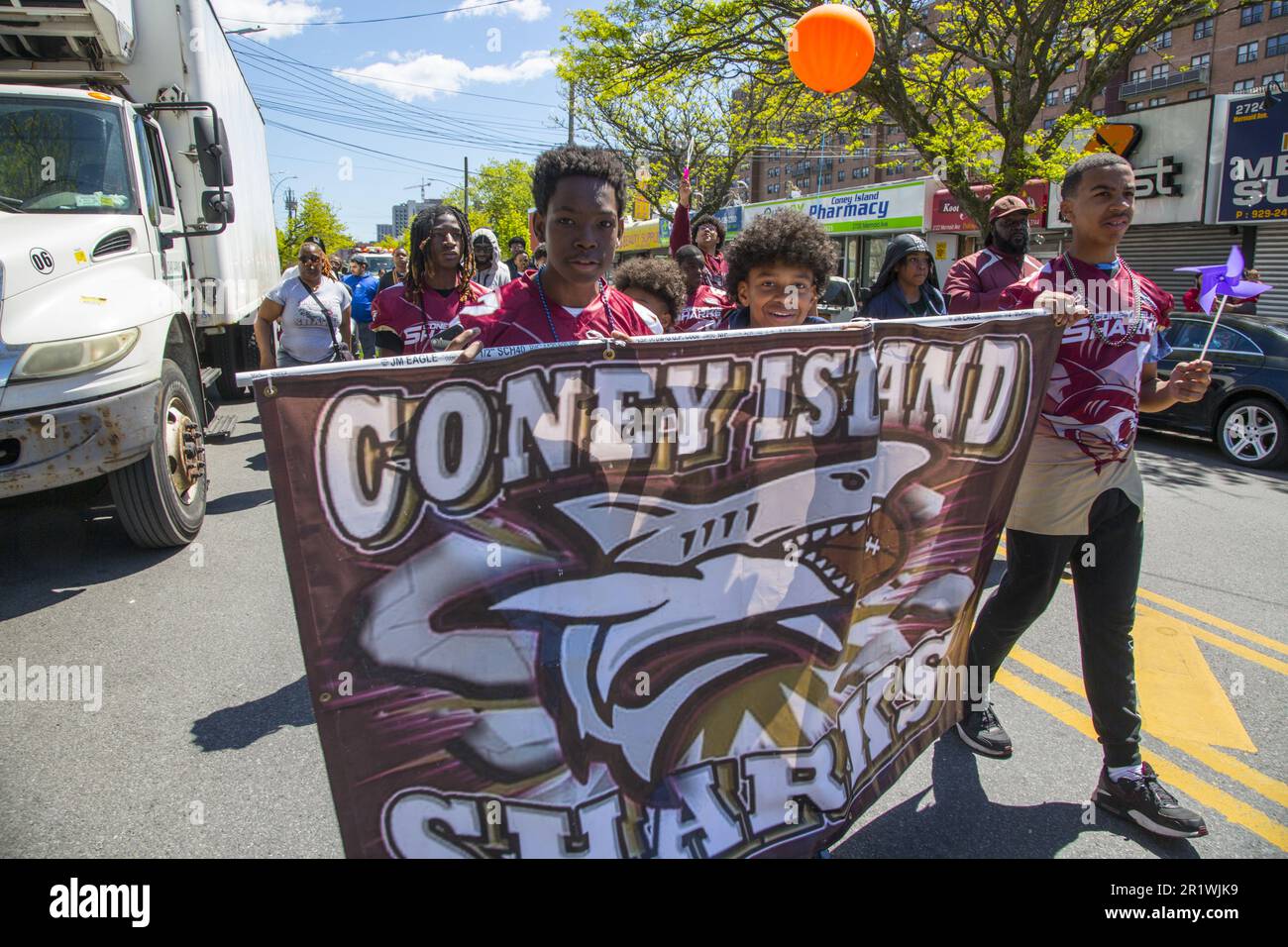 Children of various ages march along Mermaid Avenue in the Community ...