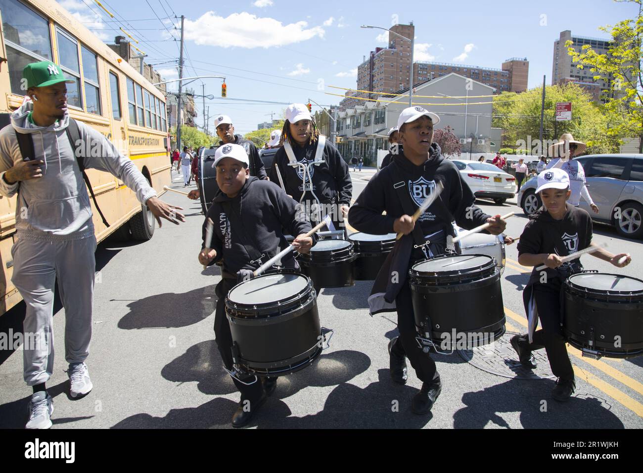 Children of various ages march along Mermaid Avenue in the Community ...