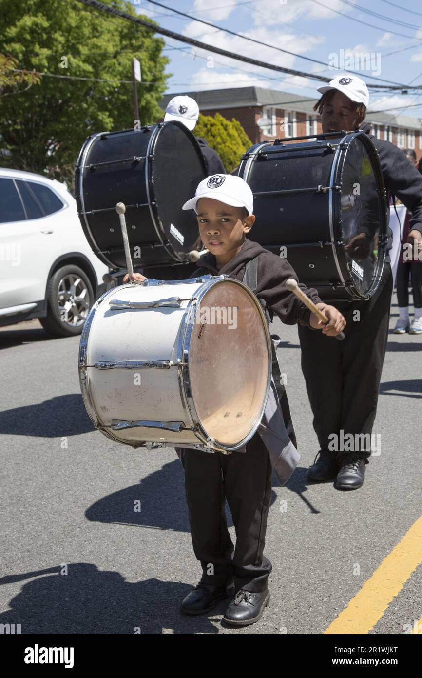 Children of various ages march along Mermaid Avenue in the Community ...