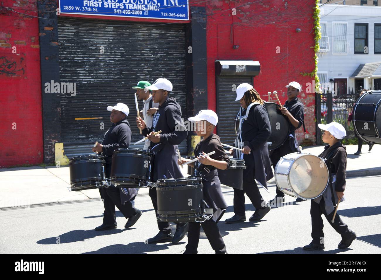 Children of various ages march along Mermaid Avenue in the Community ...