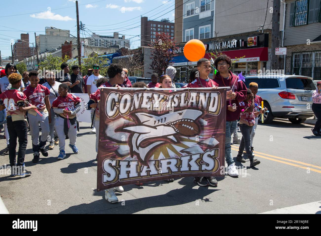 Children of various ages march along Mermaid Avenue in the Community ...