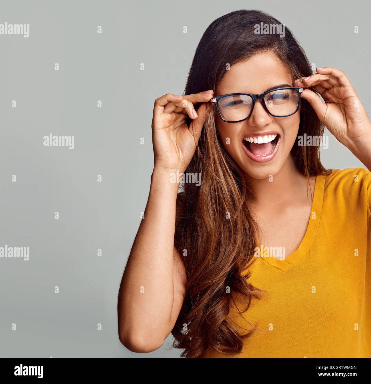 Her quirky personality shines through. Studio portrait of an attractive ...