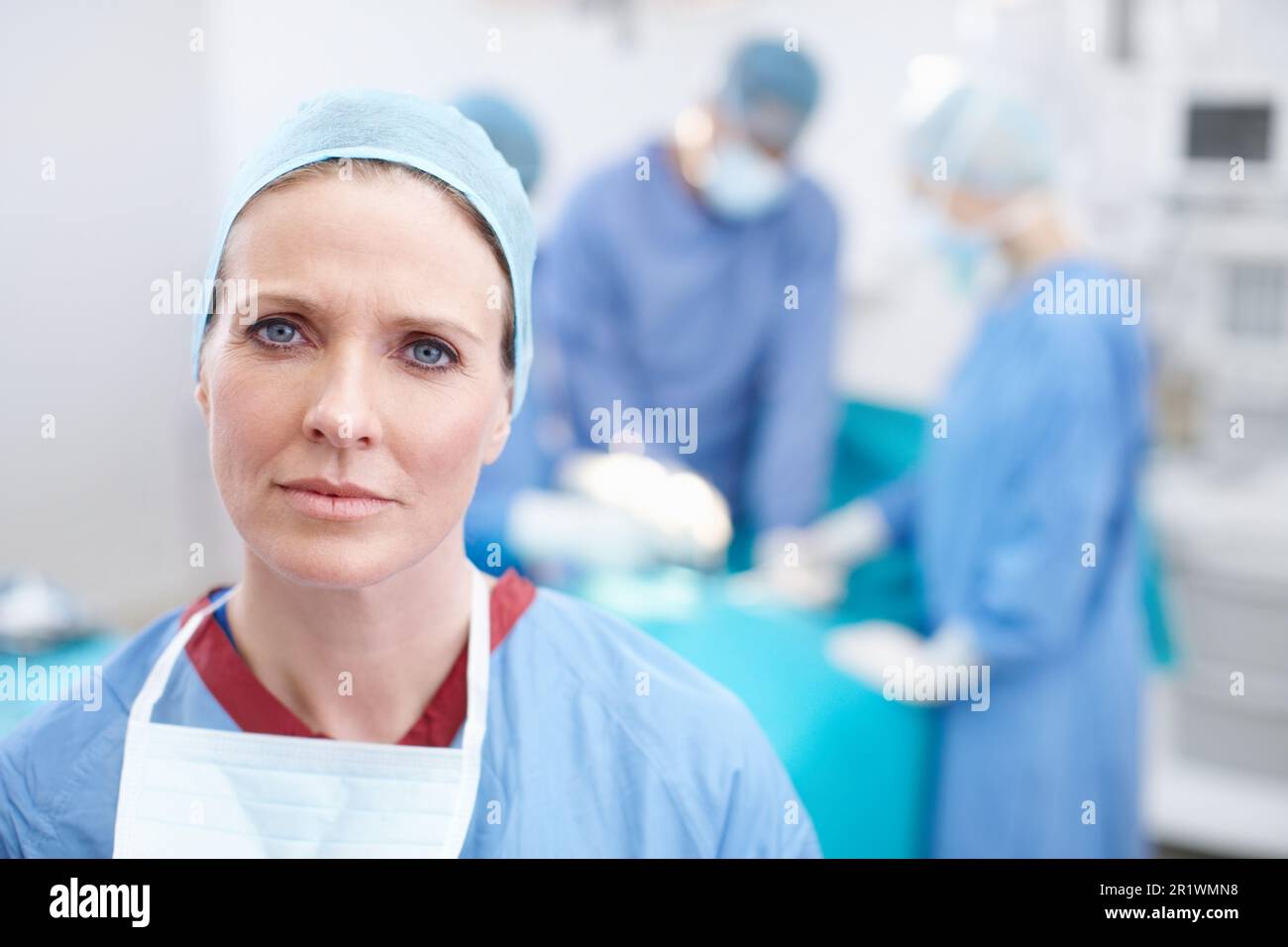 Every second counts. Portrait of a serious female doctor looking sad ...