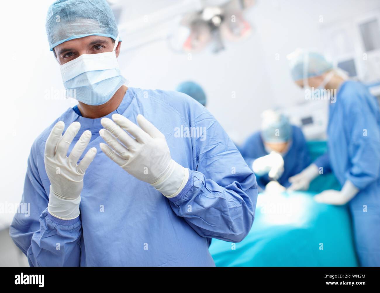 Ready to go to work. Tilted view of a surgeon wearing surgical gloves ...