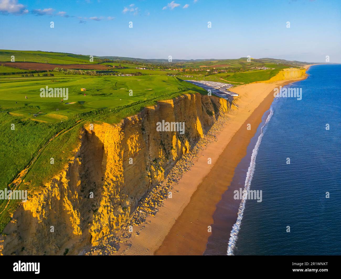 West Bay, Dorset, UK. 15th May 2023. UK Weather. View from the air of the iconic sand stone ...