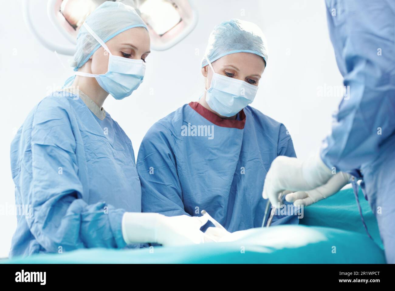 Teaching her to one day take over. Two female surgeons working together ...