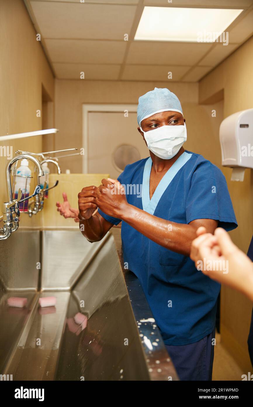 Sterilised for the upcoming surgery. a team of surgeons sterilizing ...