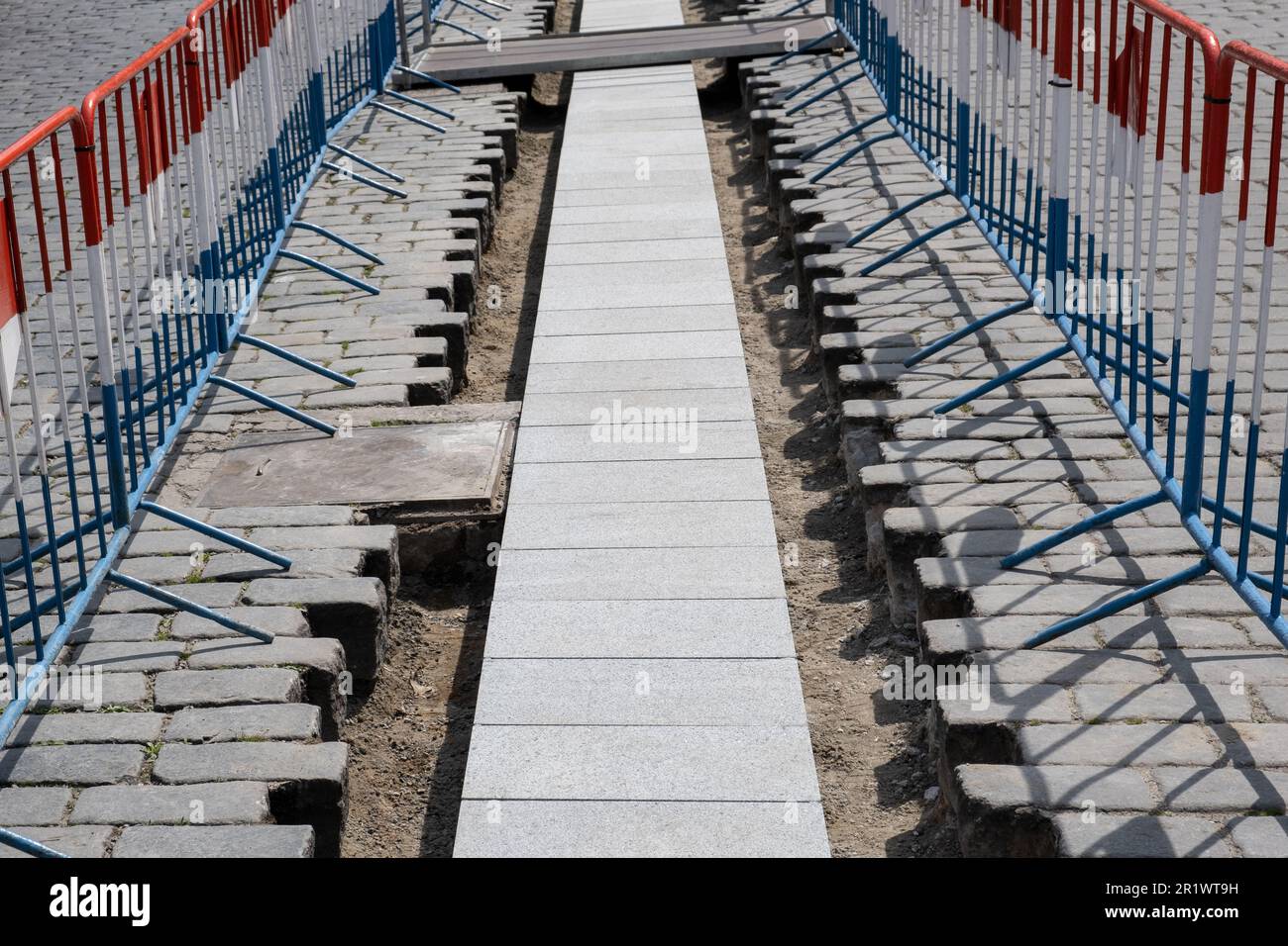 Installing new infrastructure in old street cobblestone covered Stock ...