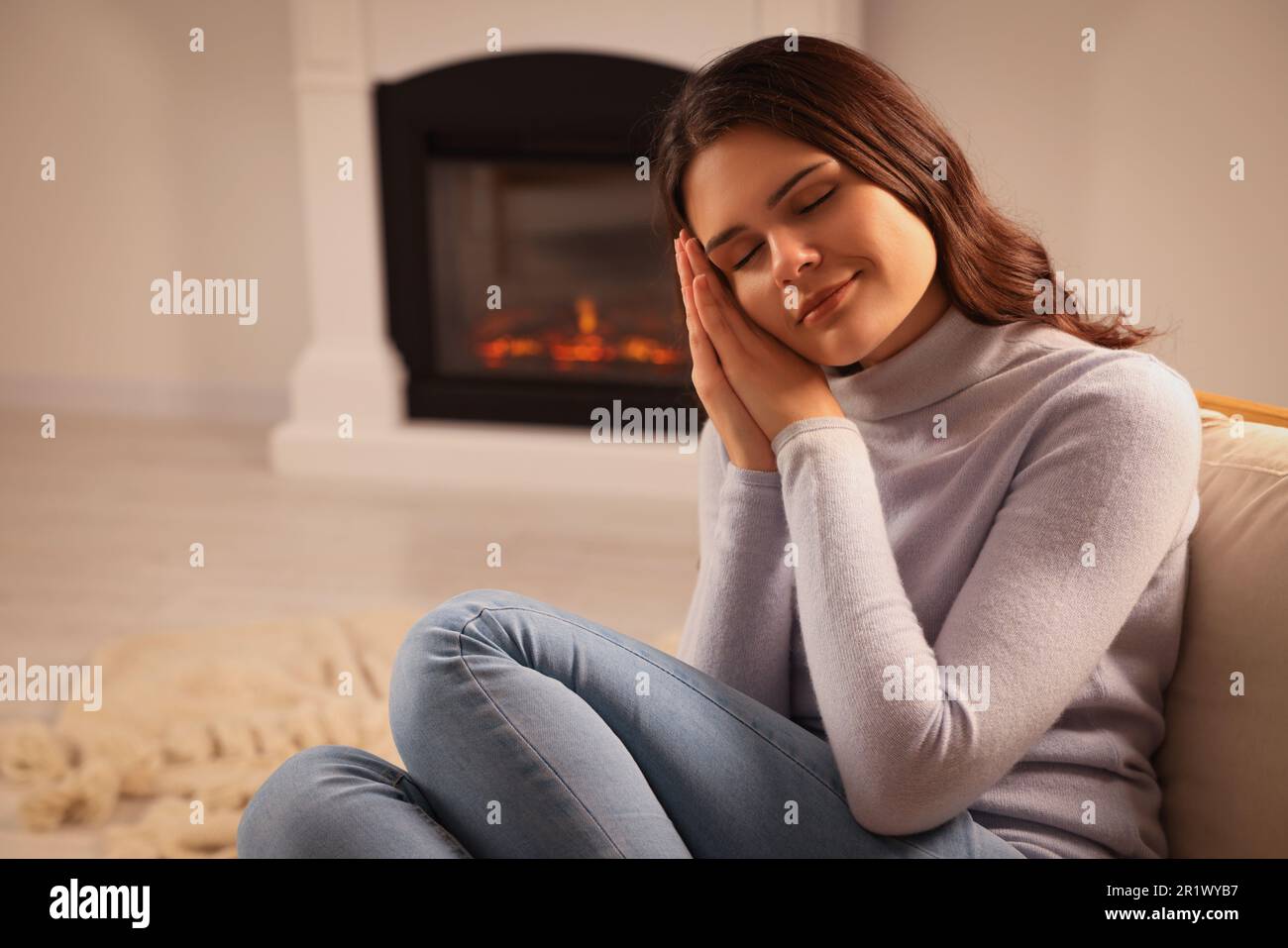 Woman sleeping fireplace hi-res stock photography and images - Alamy