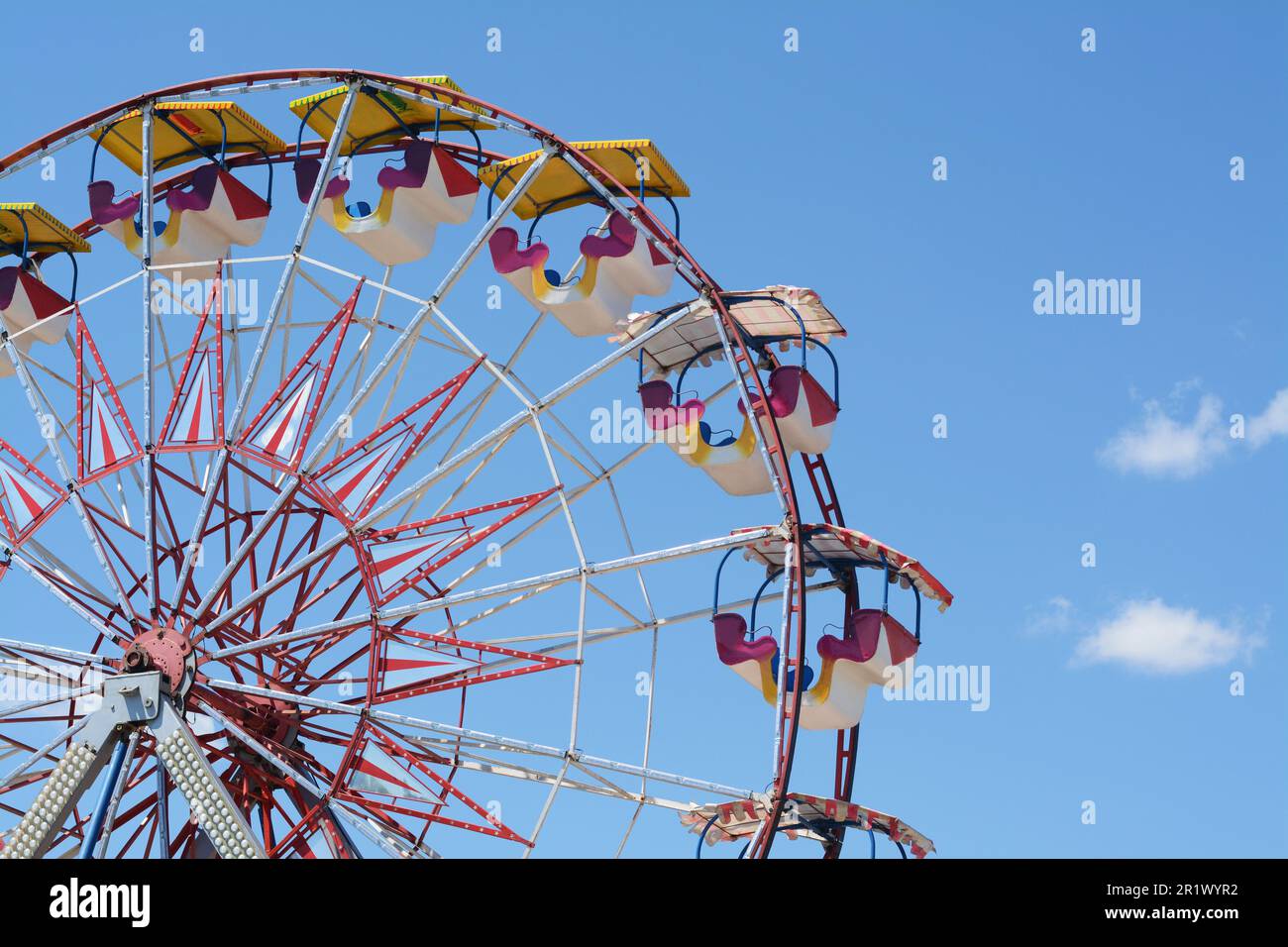 Large empty observation wheel against blue sky Stock Photo - Alamy