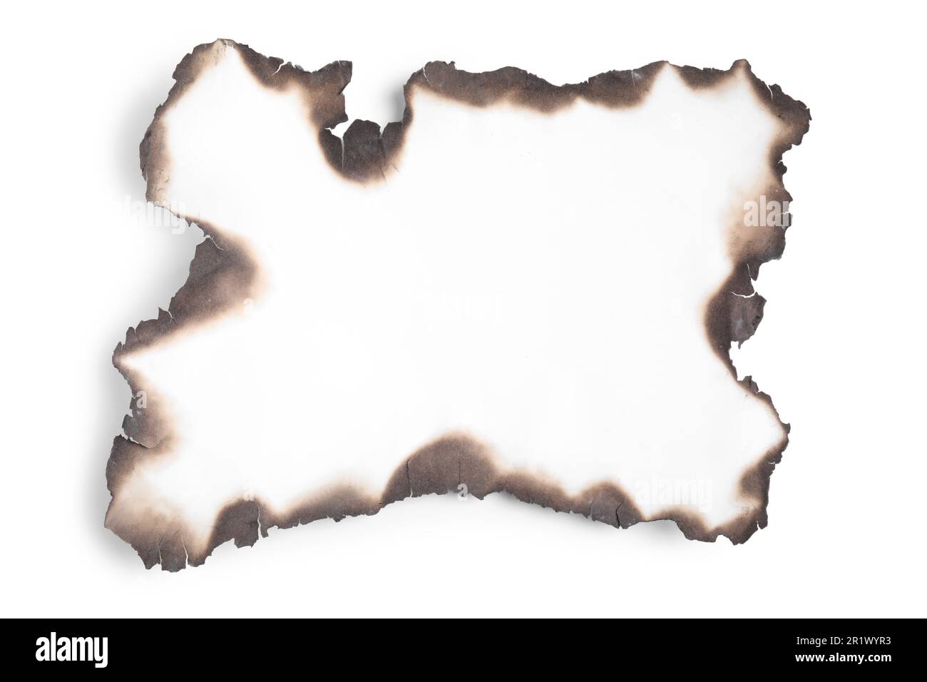 Piece of paper with dark burnt borders on white background, top view ...