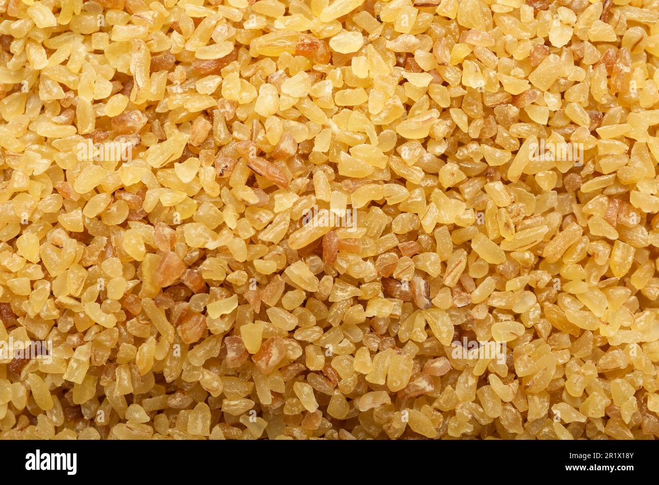 Pile of uncooked bulgur as background, top view Stock Photo - Alamy