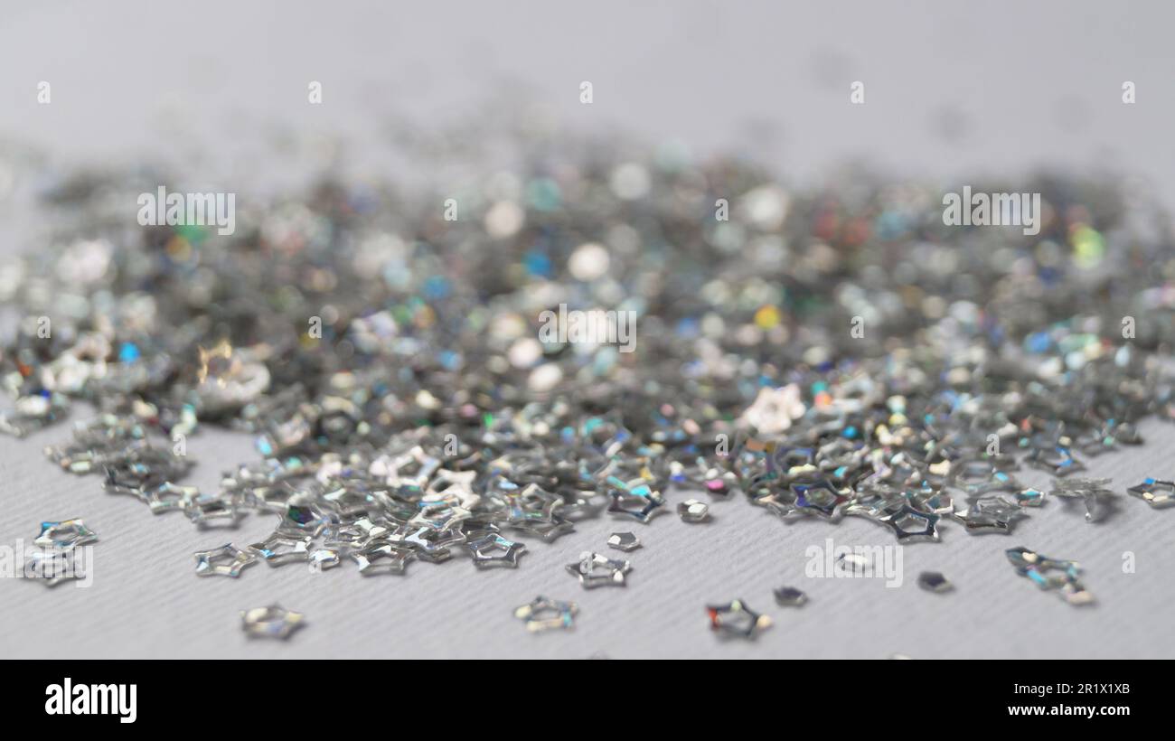 Pile of silver star shaped sequins on white background, closeup Stock ...