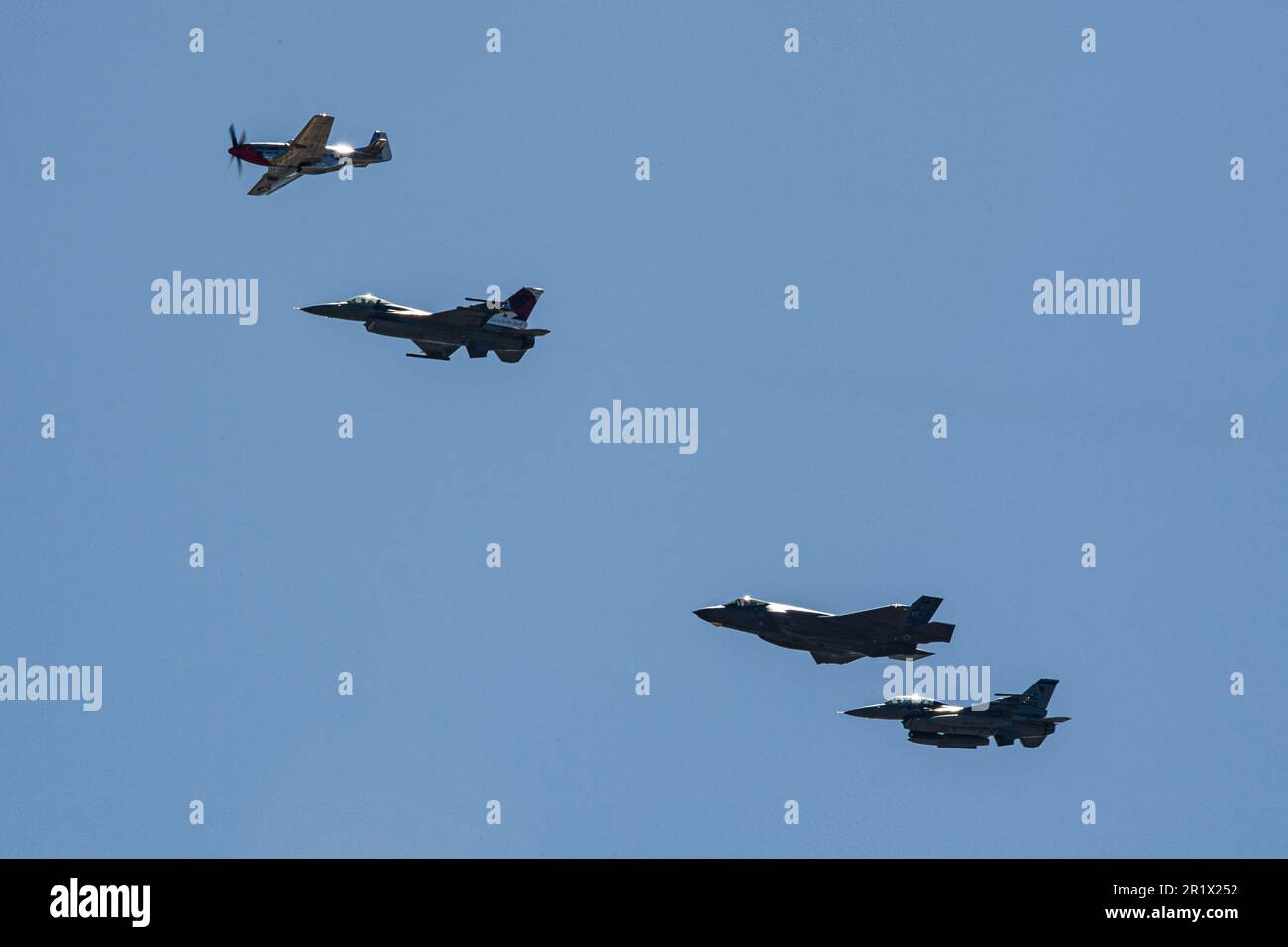 A P-51 Mustang, an F-16C Fighting Falcon, assigned to the 120th Fighter ...