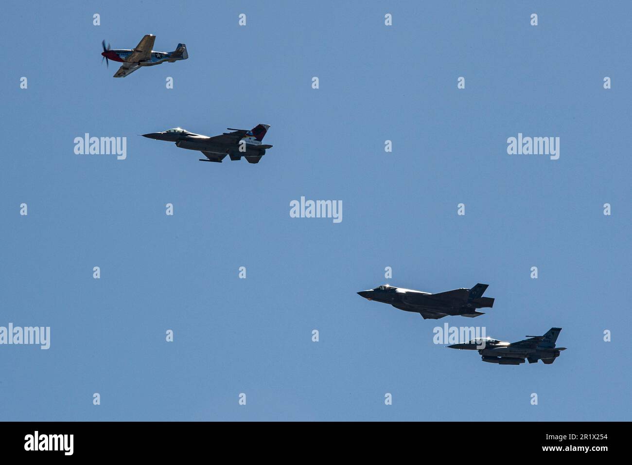 A P-51 Mustang, an F-16C Fighting Falcon, assigned to the 120th Fighter ...