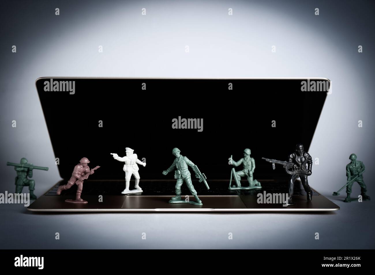 Hybrid warfare concept, online information battle. Laptop and toy ...