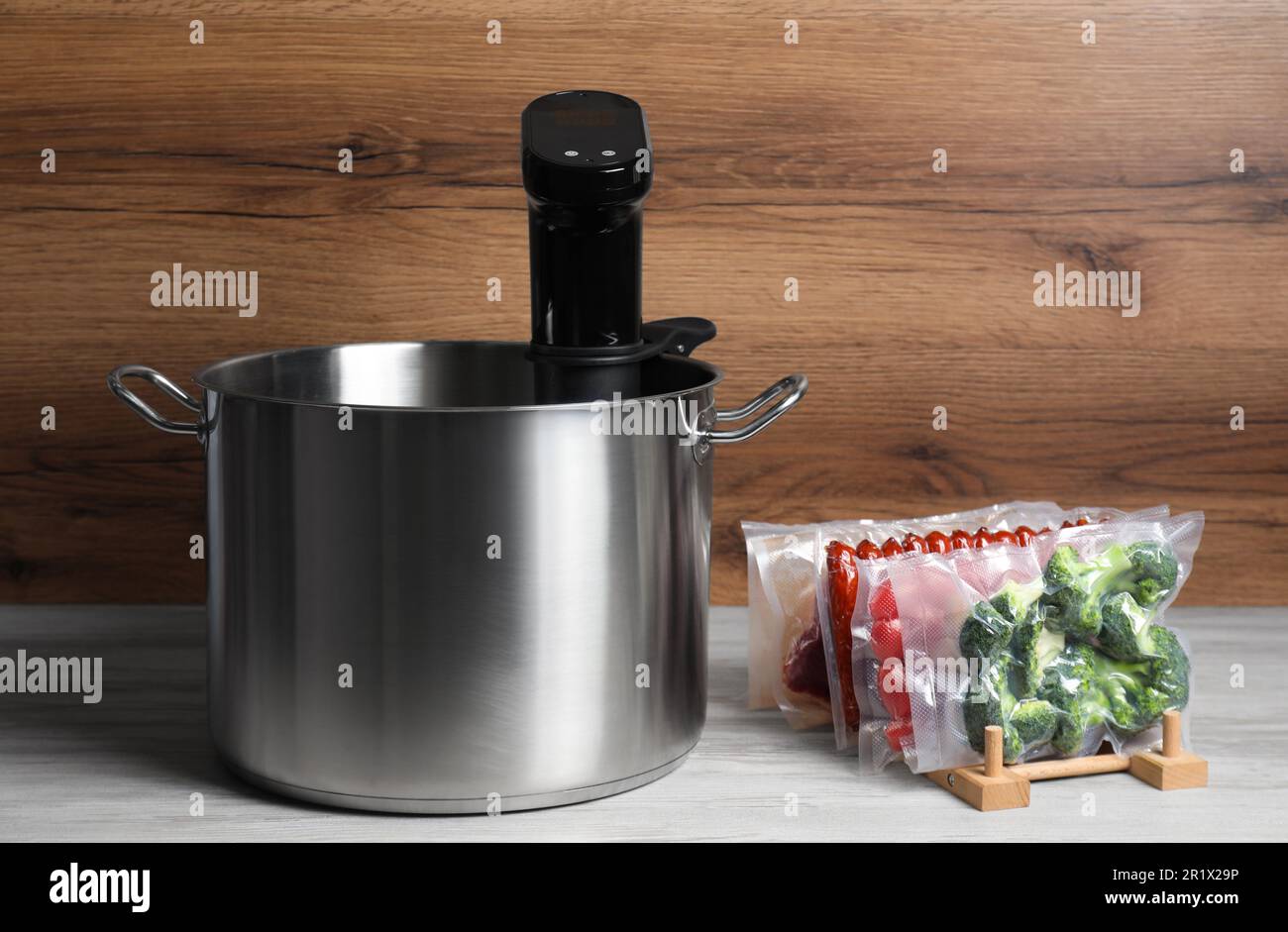 Sous vide cooking. Thermal immersion circulator in pot and vacuum ...
