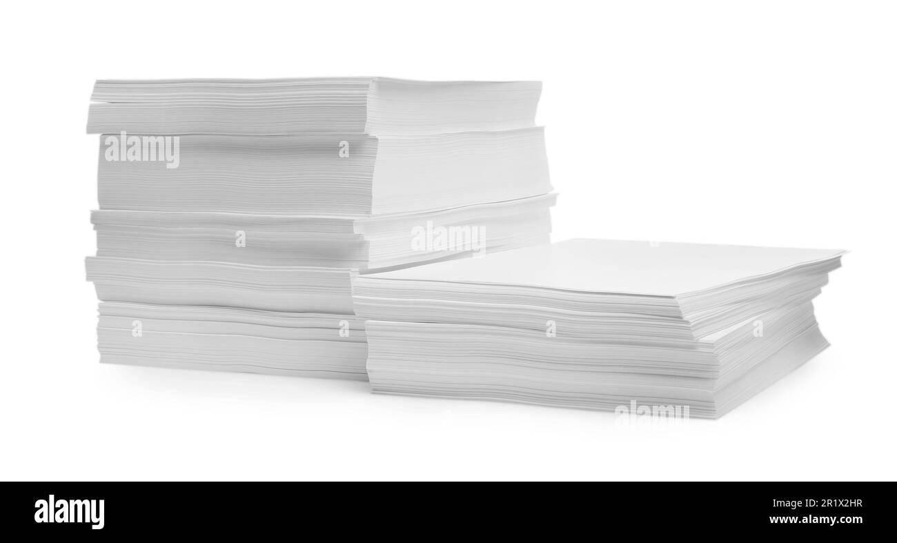 Stacks of paper sheets on white background Stock Photo - Alamy