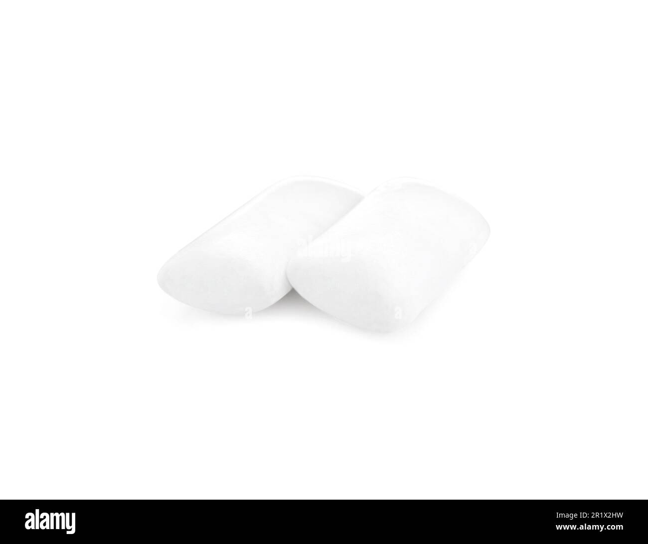 Two pieces of chewing gum on white background Stock Photo - Alamy