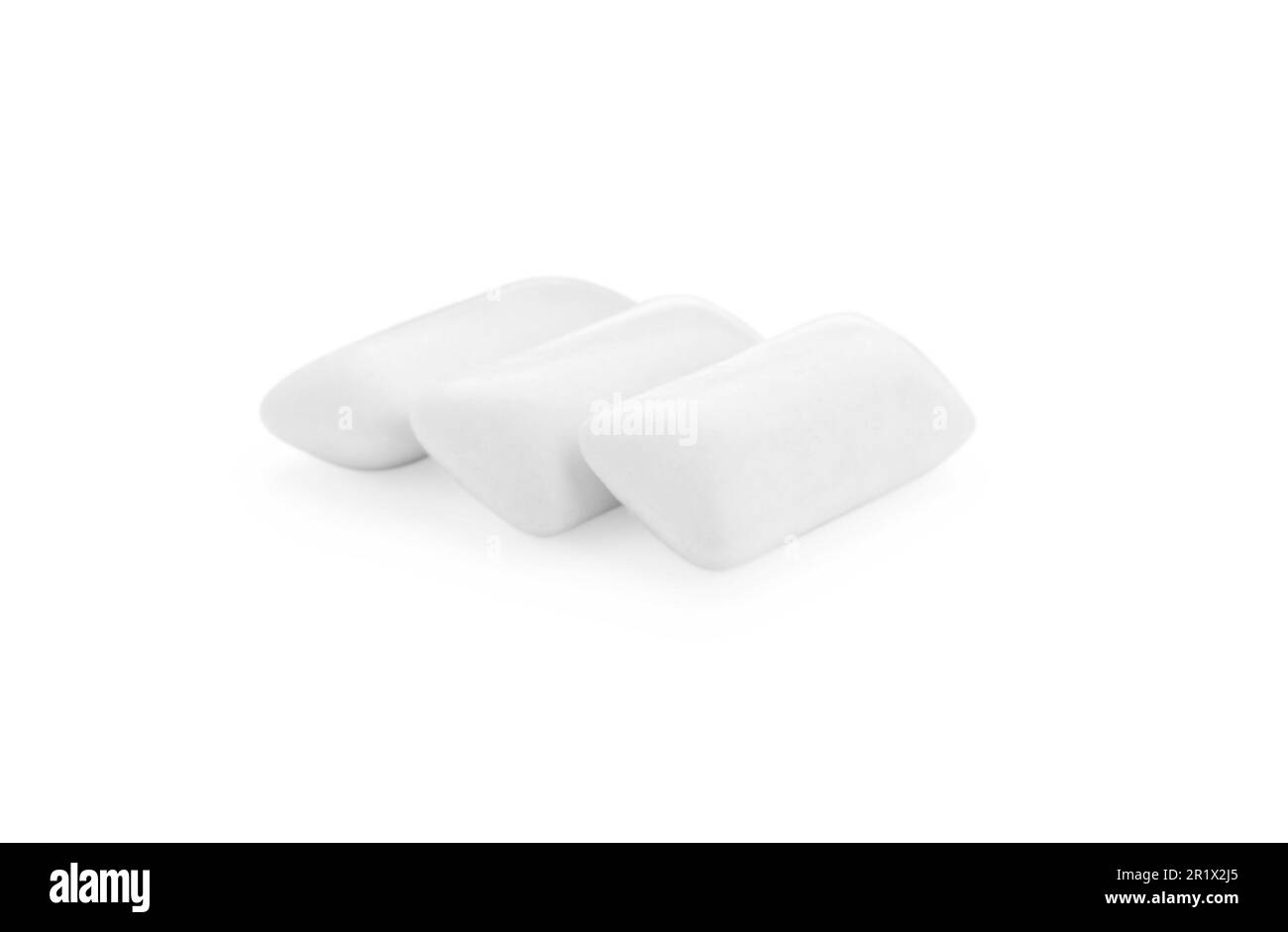 Three chewing gum pieces on white background Stock Photo - Alamy