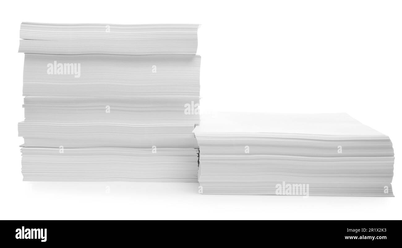 Stacks of paper sheets on white background Stock Photo - Alamy
