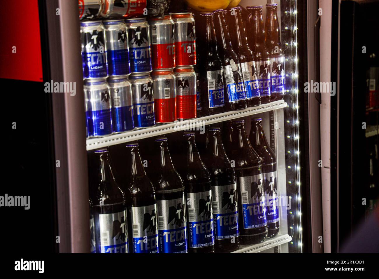 Detail of loggerhead glass bottles of Tecate Roja beer, Tecate Light ...