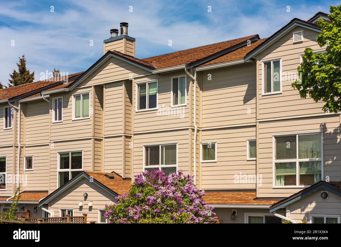 Facade of new residential townhouses. Modern apartment buildings in Richmond Canada. Modern ...