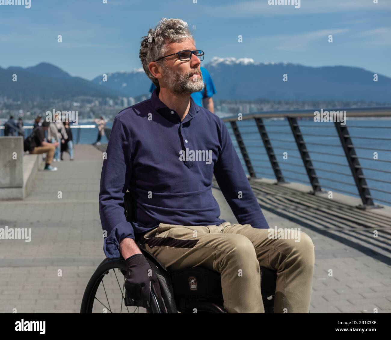 New start. Disabled man in wheelchair outdoor. Thoughtful concentrated ...