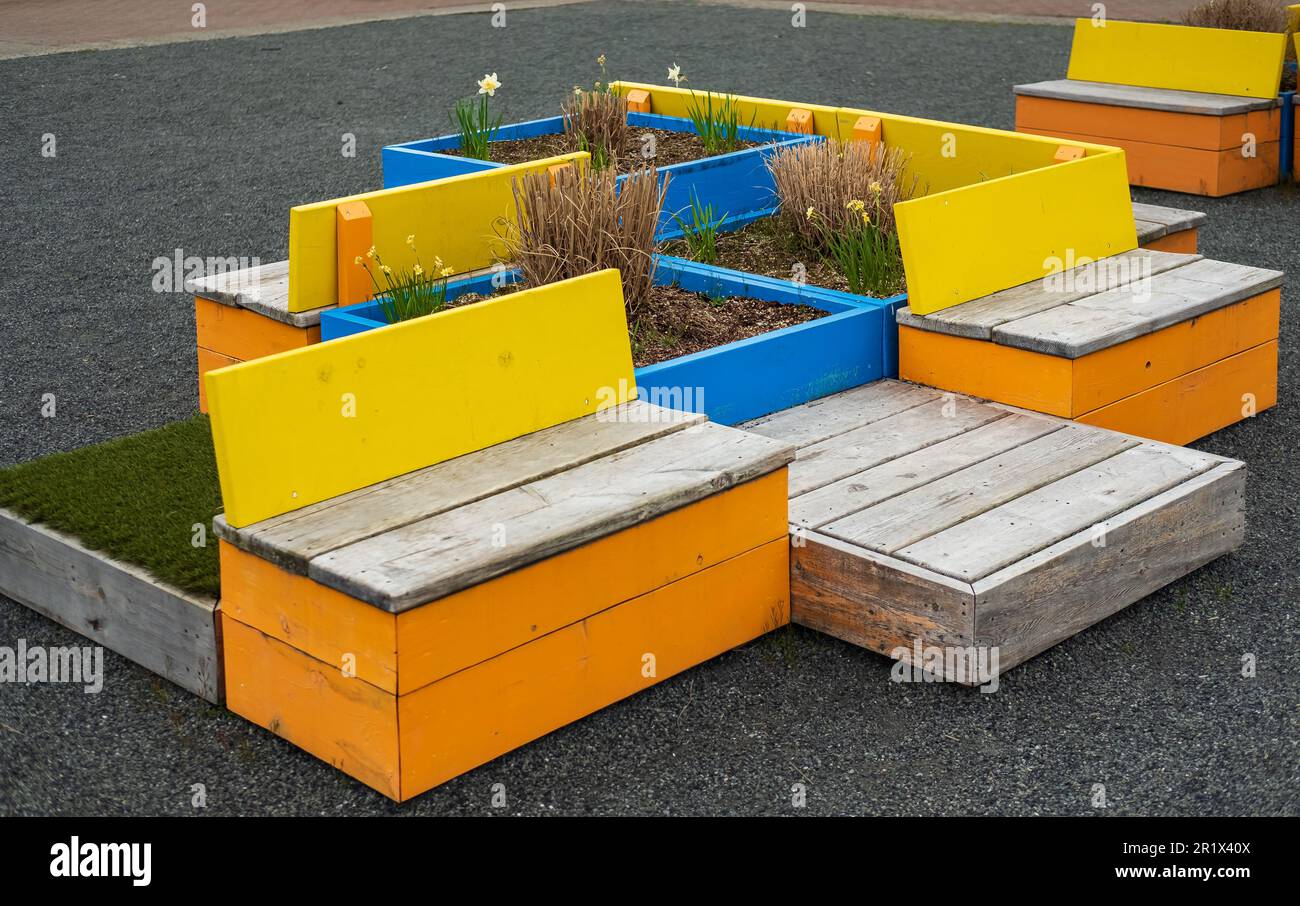 Colorful wooden benches in the urban city park. Furniture for garden ...