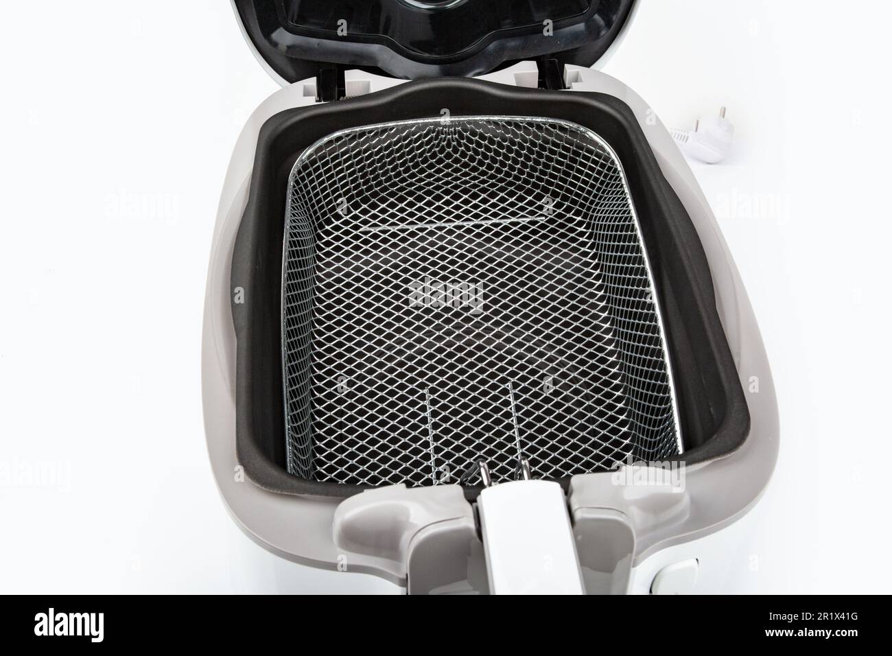 Basket from Air Fryer isolated on white background Stock Photo - Alamy