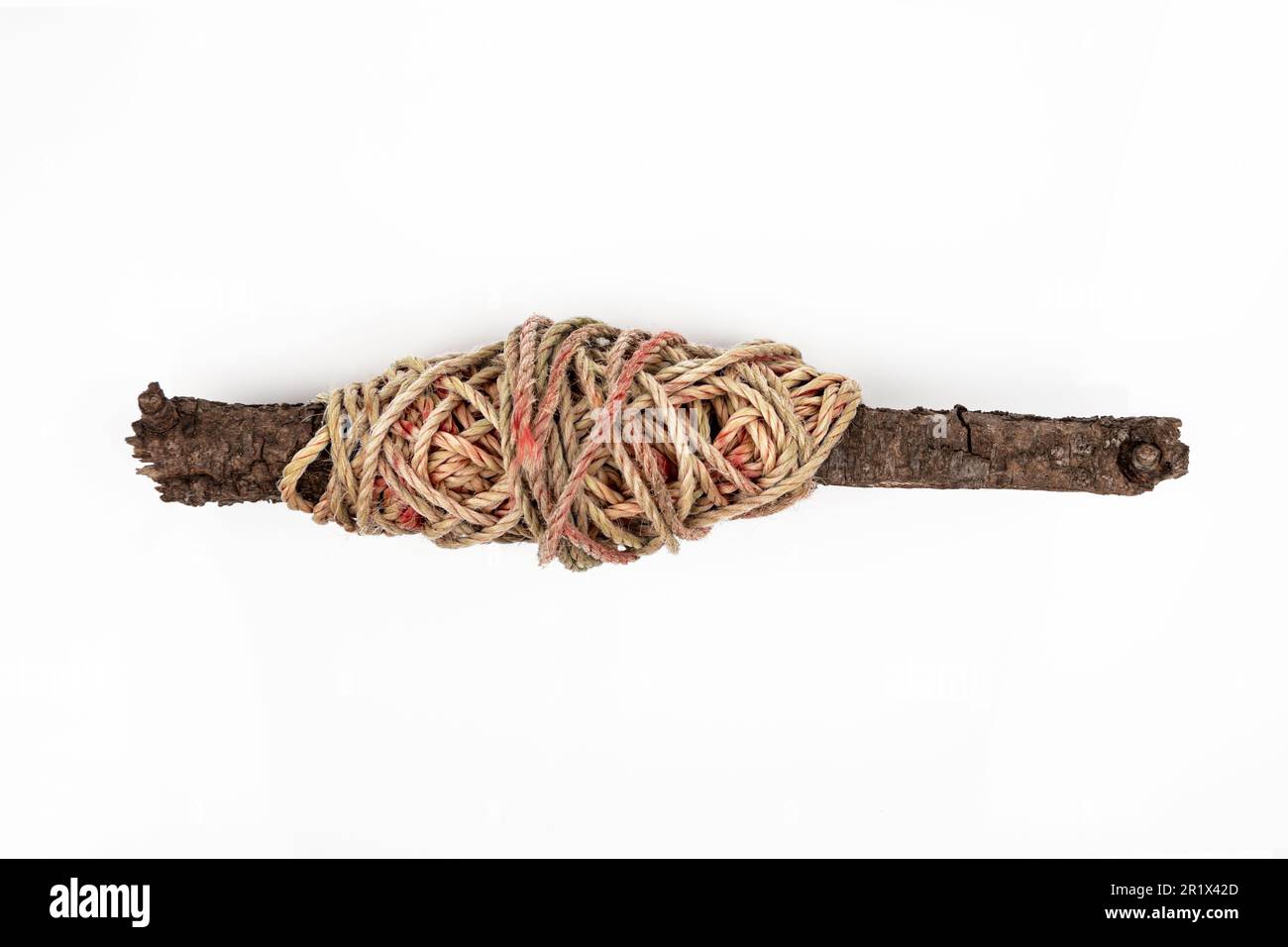 Cord coiled on a piece of wood isolated over white background Stock ...