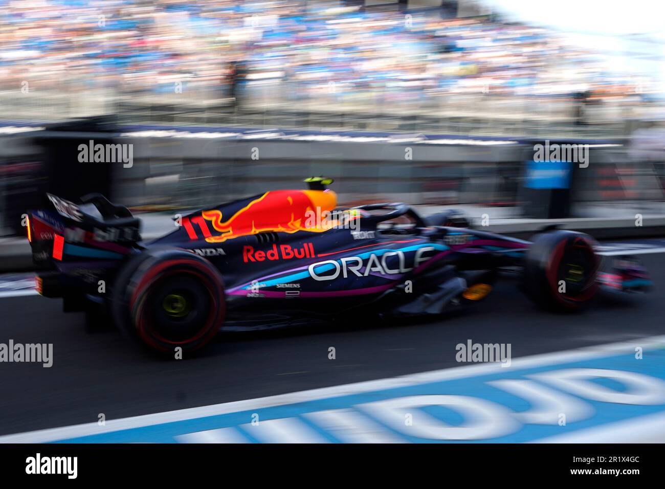 Red Bull driver Sergio Perez of Mexico drives on the pit lane during the first practice session ...