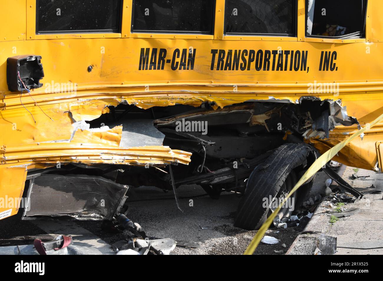 School bus involved in an accident left with a gaping hole and extreme ...