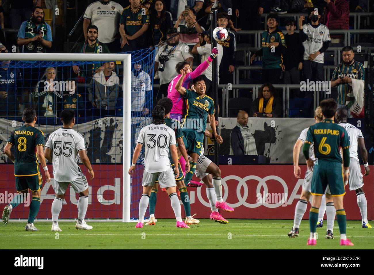 Los Angeles Galaxy goalkeeper Jonathan Bond (1) punches out a corner ...