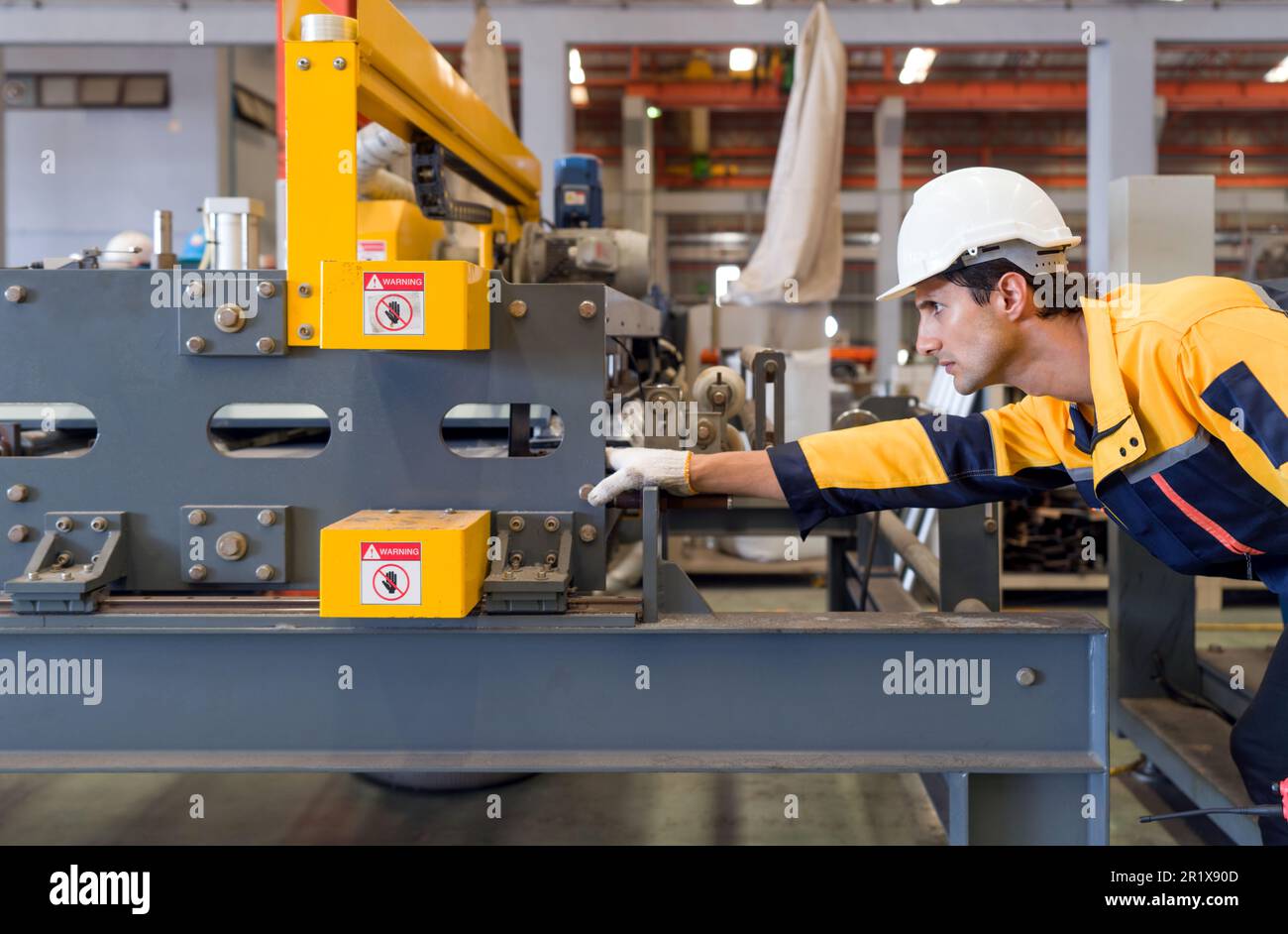 Working atmosphere in metal sheet factory with large industrial ...