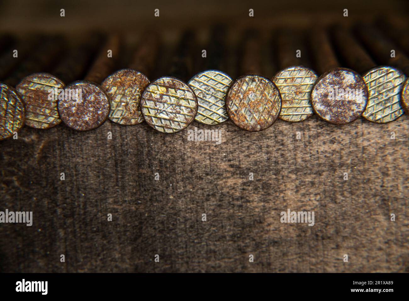 old rusty, 16 penny nail heads, line of heavy penny nails for ...