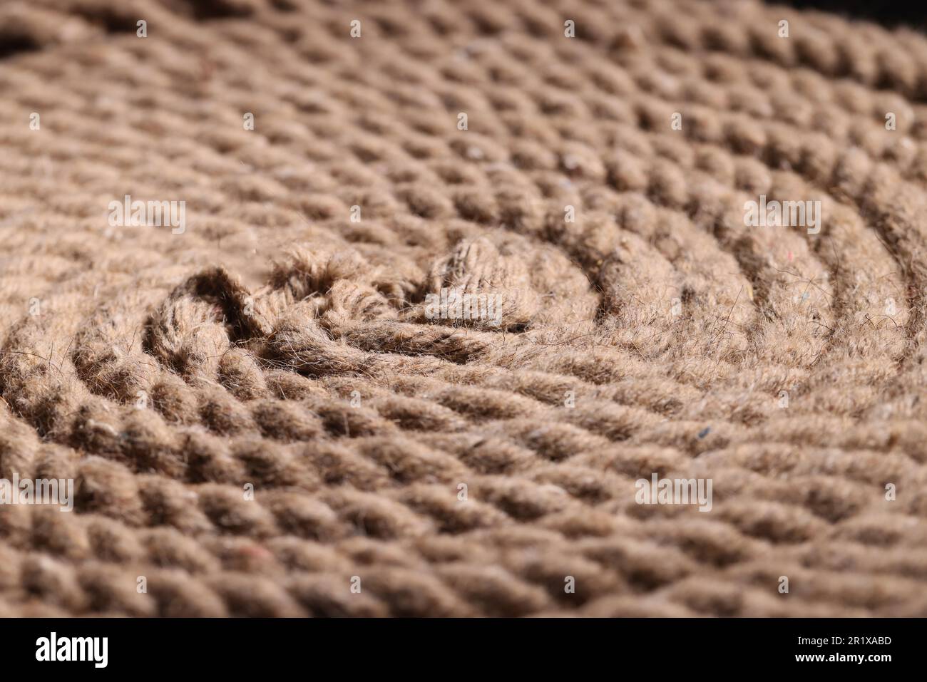 Rope made of cotton twisted into spiral lies on surface Stock Photo - Alamy