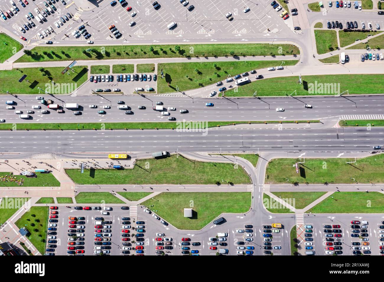 aerial view of shopping mall parking lot full of cars and car traffic ...