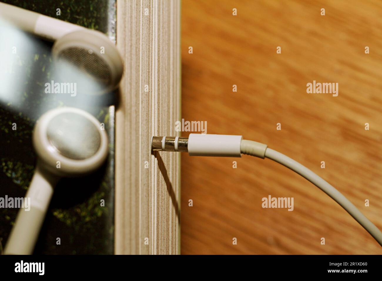 Earphone cable inside the pages of a book . Conceptual ebook idea Stock ...
