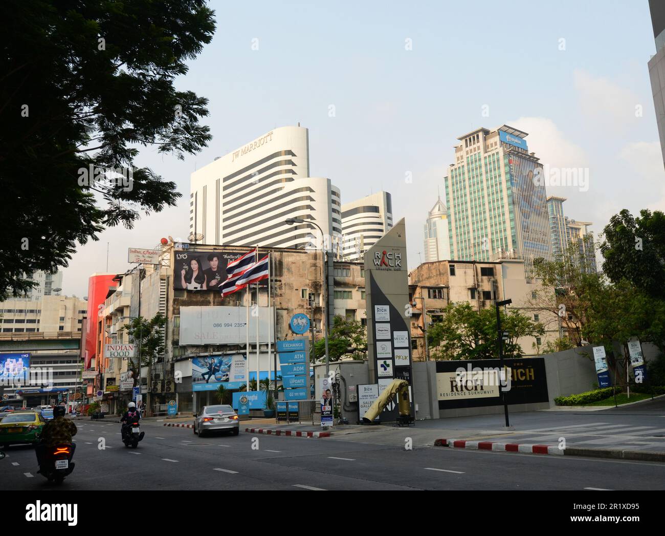 Old crumbling buildings with a modern skyline in the background ...