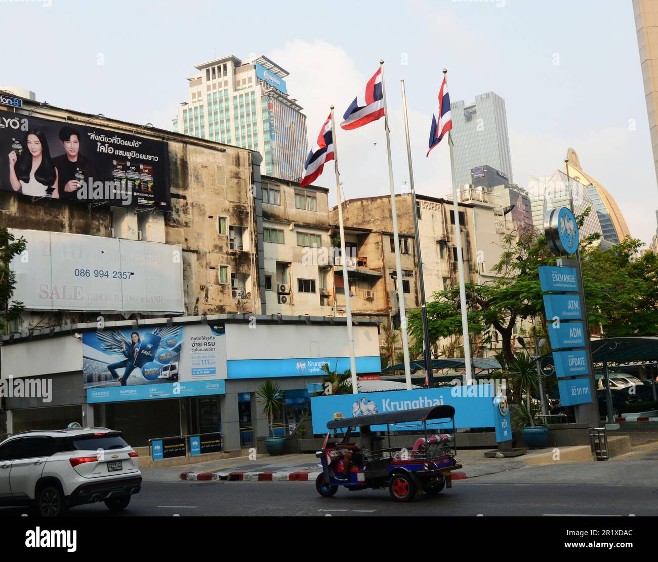 Old crumbling buildings with a modern skyline in the background ...