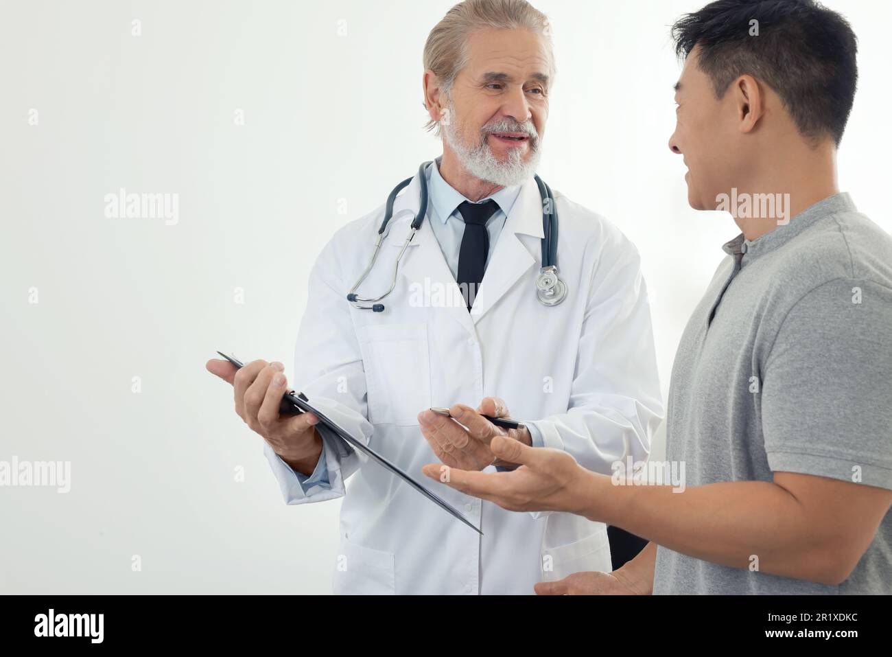 Patient having appointment with doctor on white background Stock Photo ...