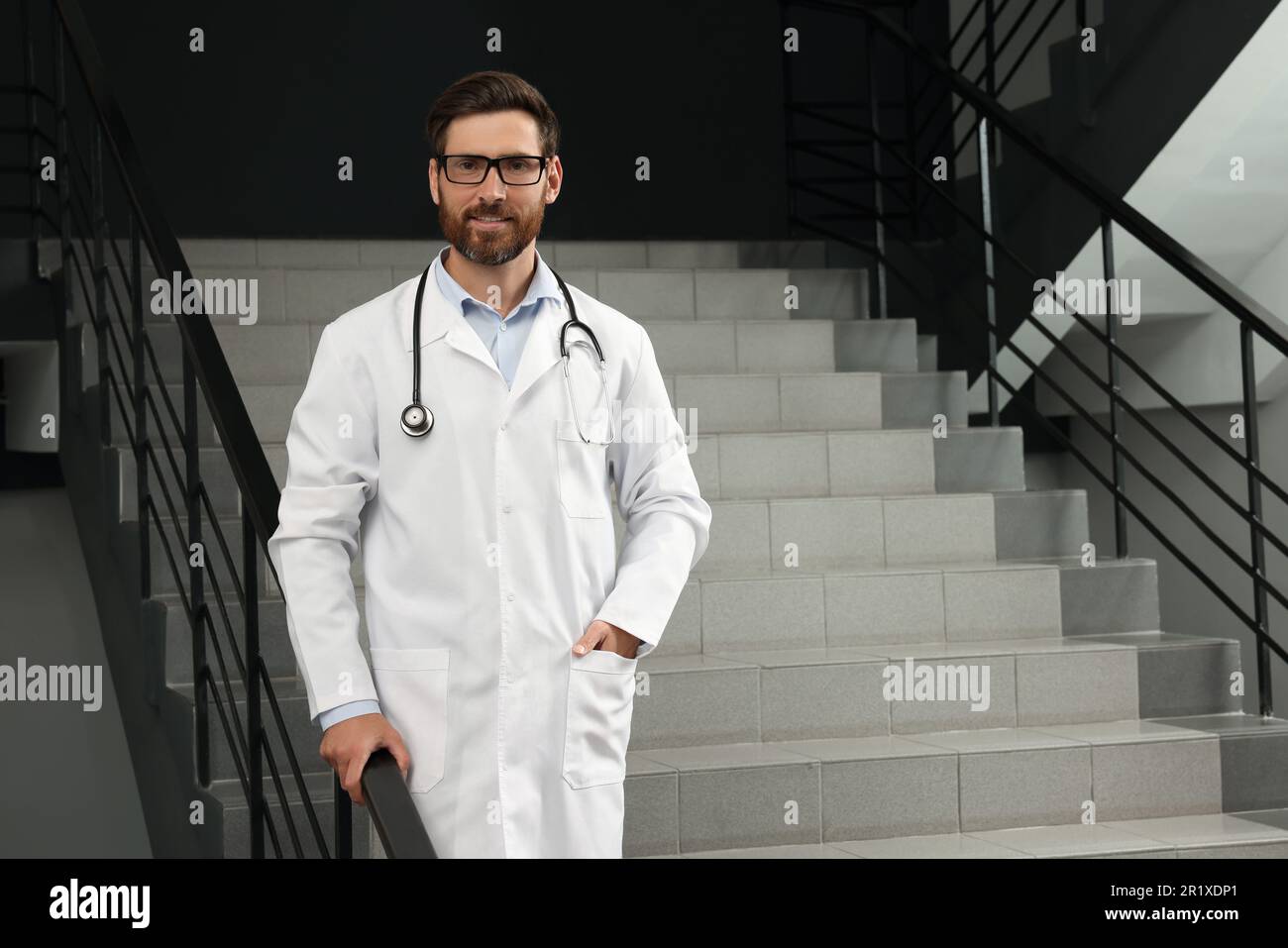 Doctor with stethoscope on stairs in hospital. Space for text Stock ...