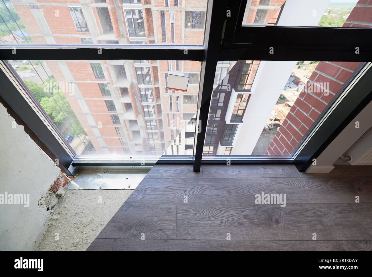 Comparison of living room with large panoramic windows before and after ...